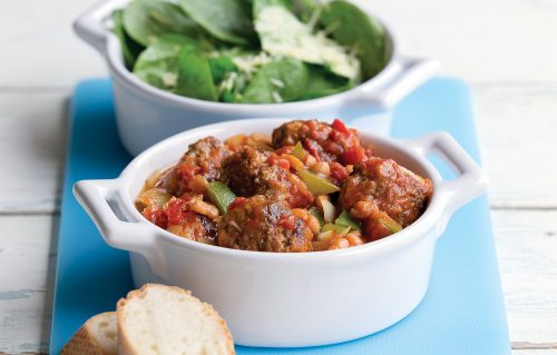 Mini meatballs in a baked bean sauce with leafy green salad and crusty ...